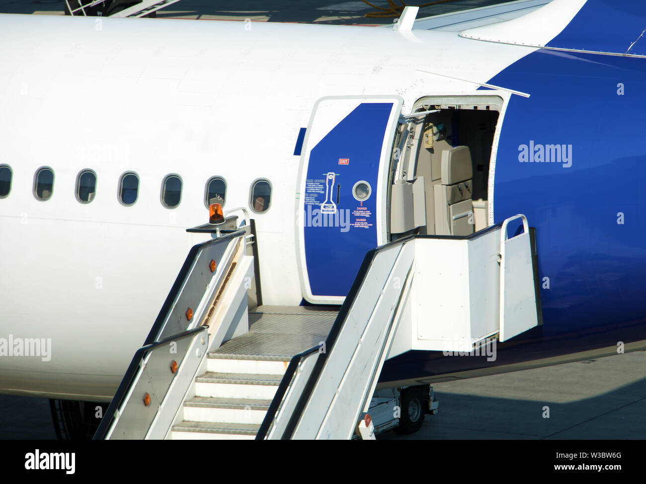 A stairs are ready under the open rear door of the aircraft, after ...