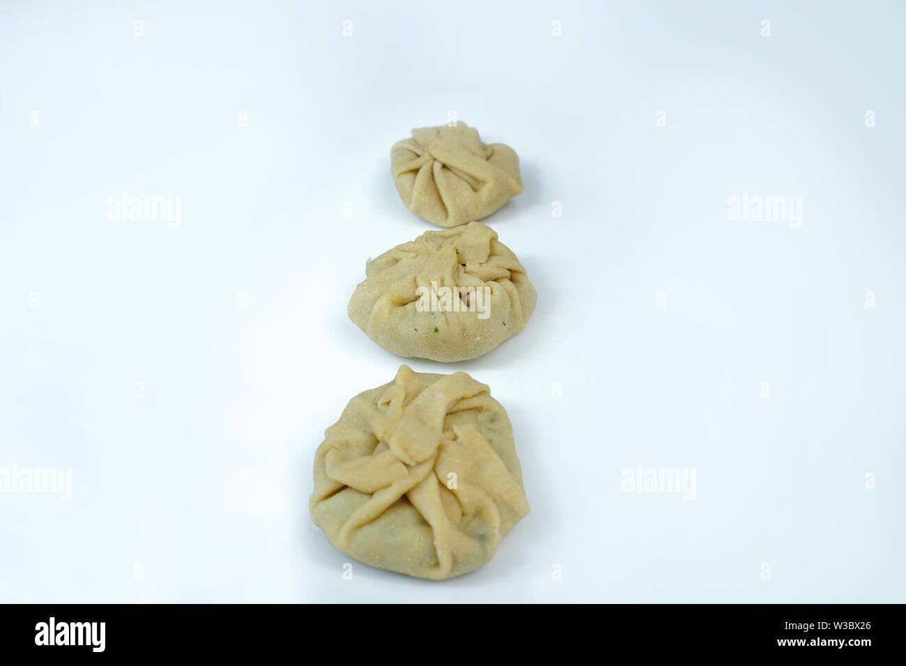 Oriental wheat all purpose flour stuffed Dumplings isolated on white ...