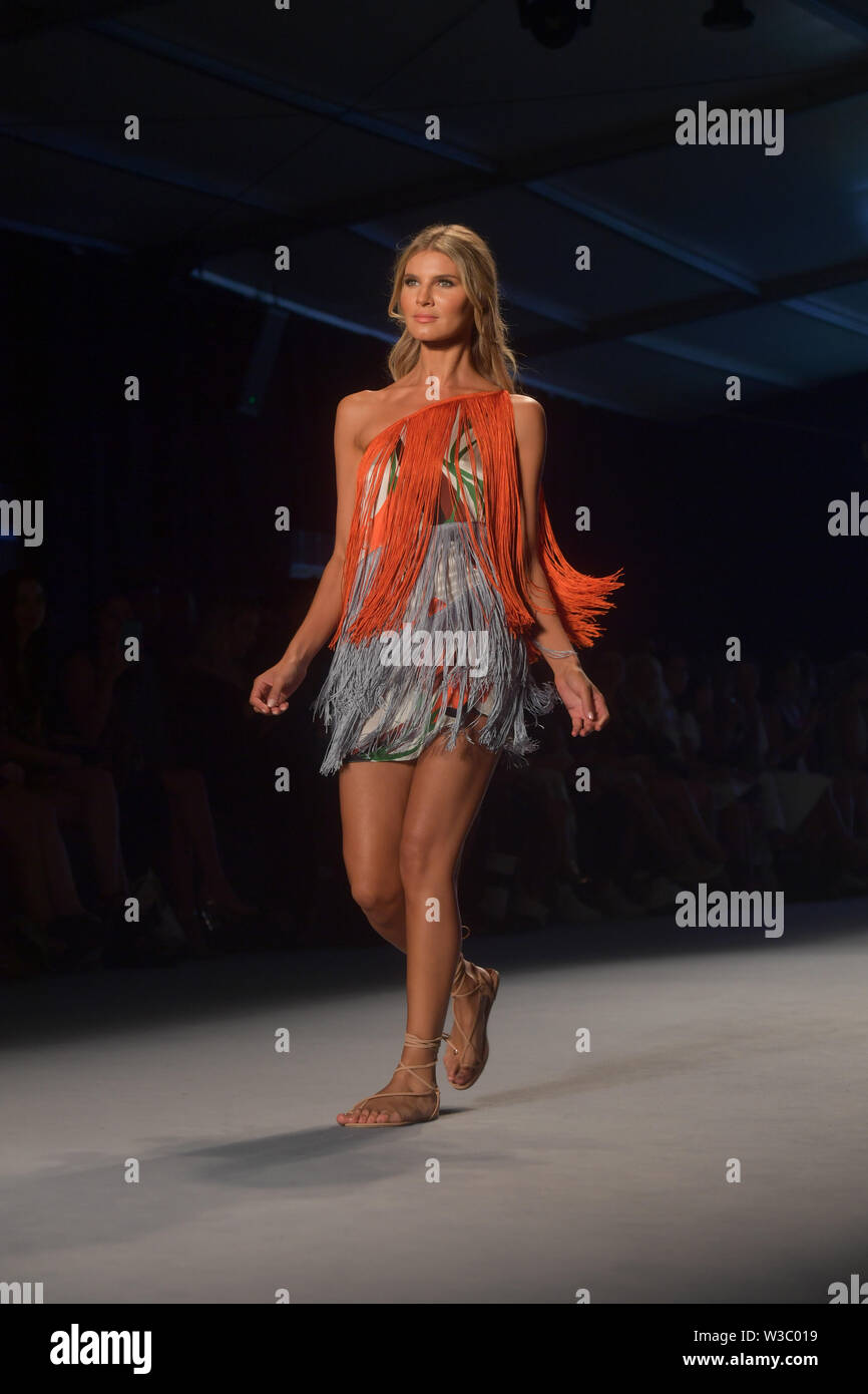 MIAMI BEACH, FLORIDA - JULY 13: A model walks the runway for Sinesia ...