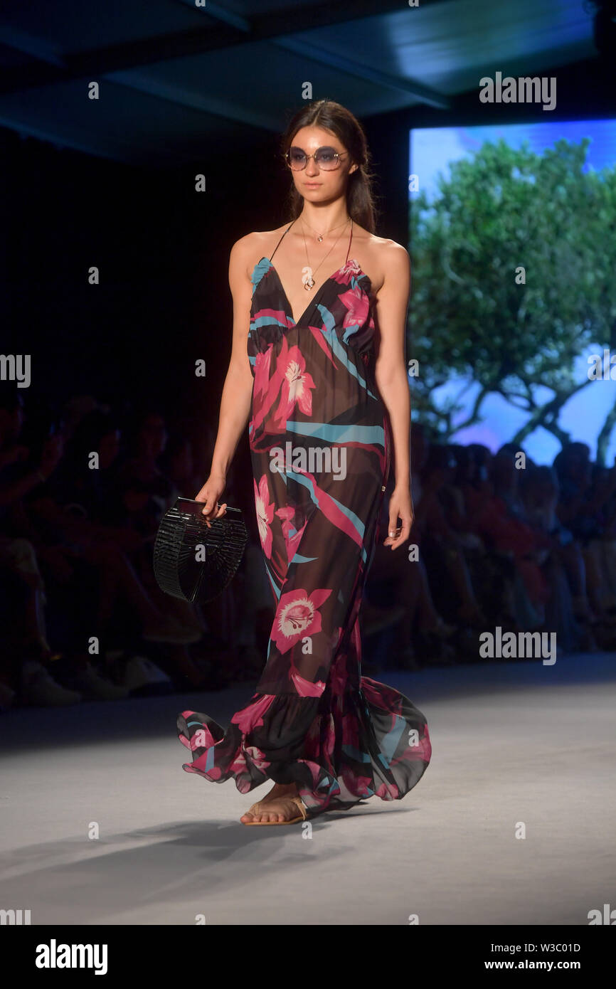 MIAMI BEACH, FLORIDA - JULY 13: A model walks the runway for Sinesia ...