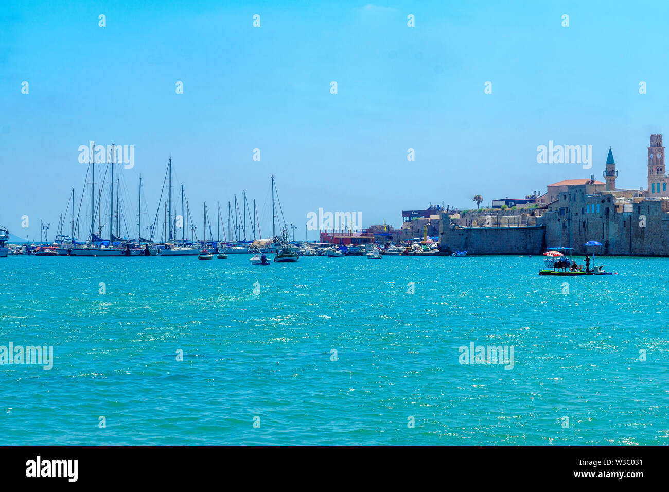 Acre, Israel - July 08, 2019: View of the sea wall and the fishing port ...