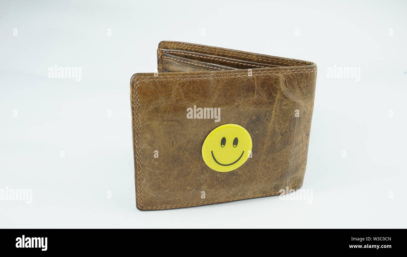Brown leather wallet with smiley happy face isolated on white ...