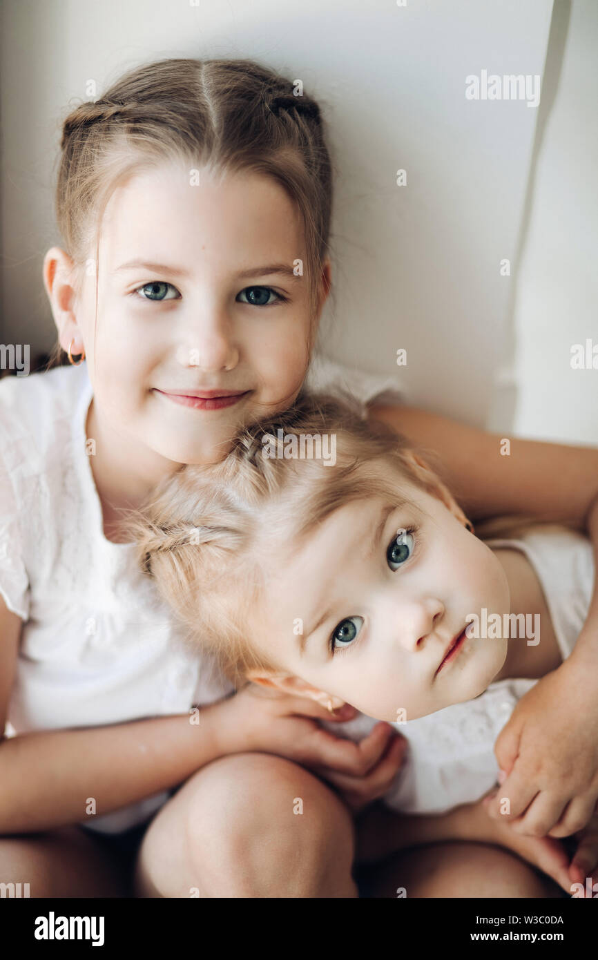 Two cute little children getting fun and playing together Stock Photo ...