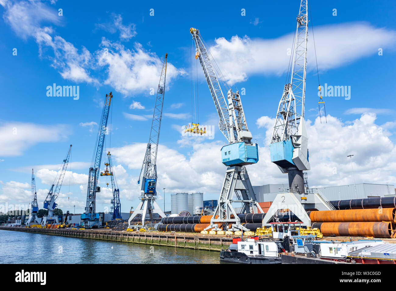 Import export logistics business. Huge cranes and pipes at ...