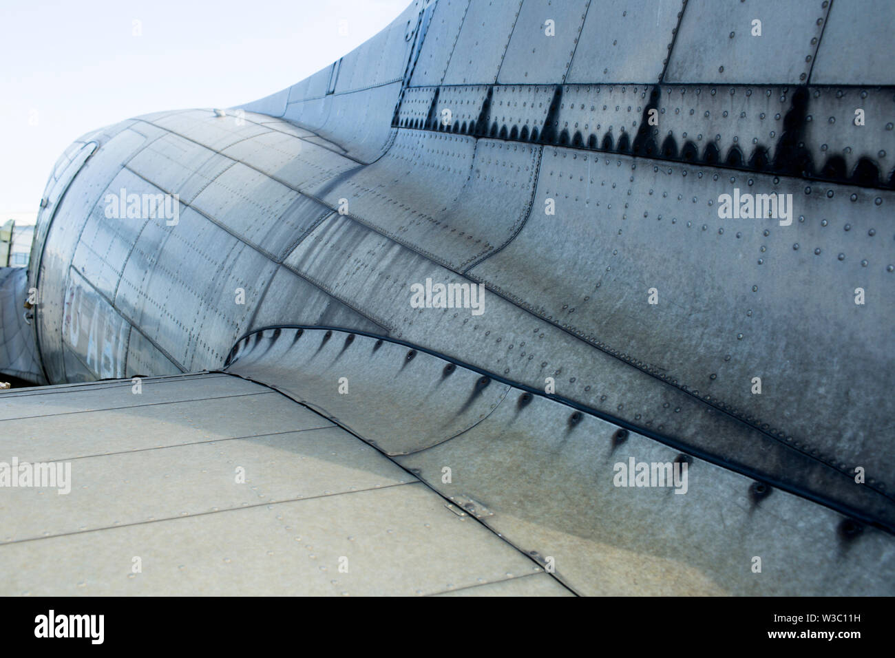 Fuselage metal surface with rivets. Aircraft covering detail on ...