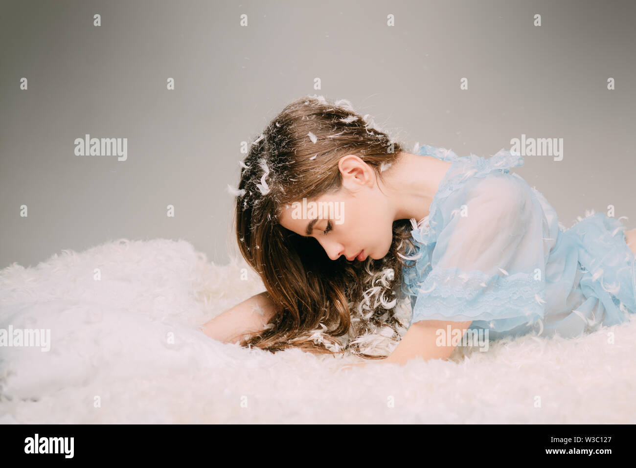 Tenderness and fragility of youth concept. Side view teenage girl lying ...