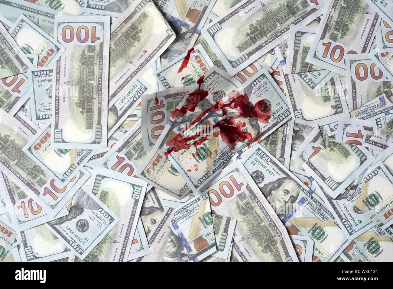 Pile of money with bloody spot, top view. Dirty criminal profit. Dollar ...