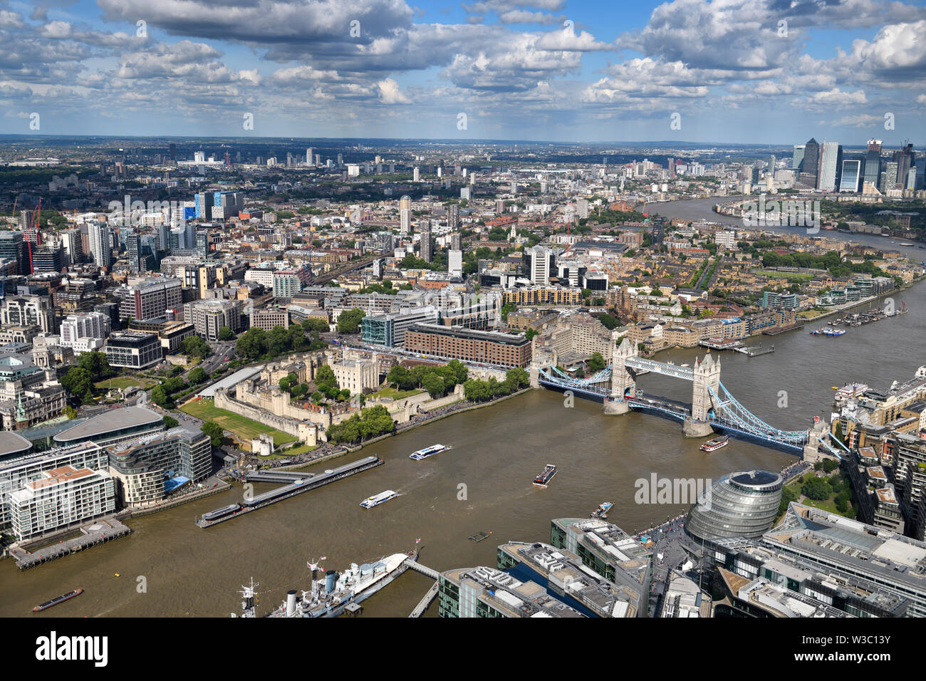 Aerial view of the muddy River Thames with Tower of London Castle ...