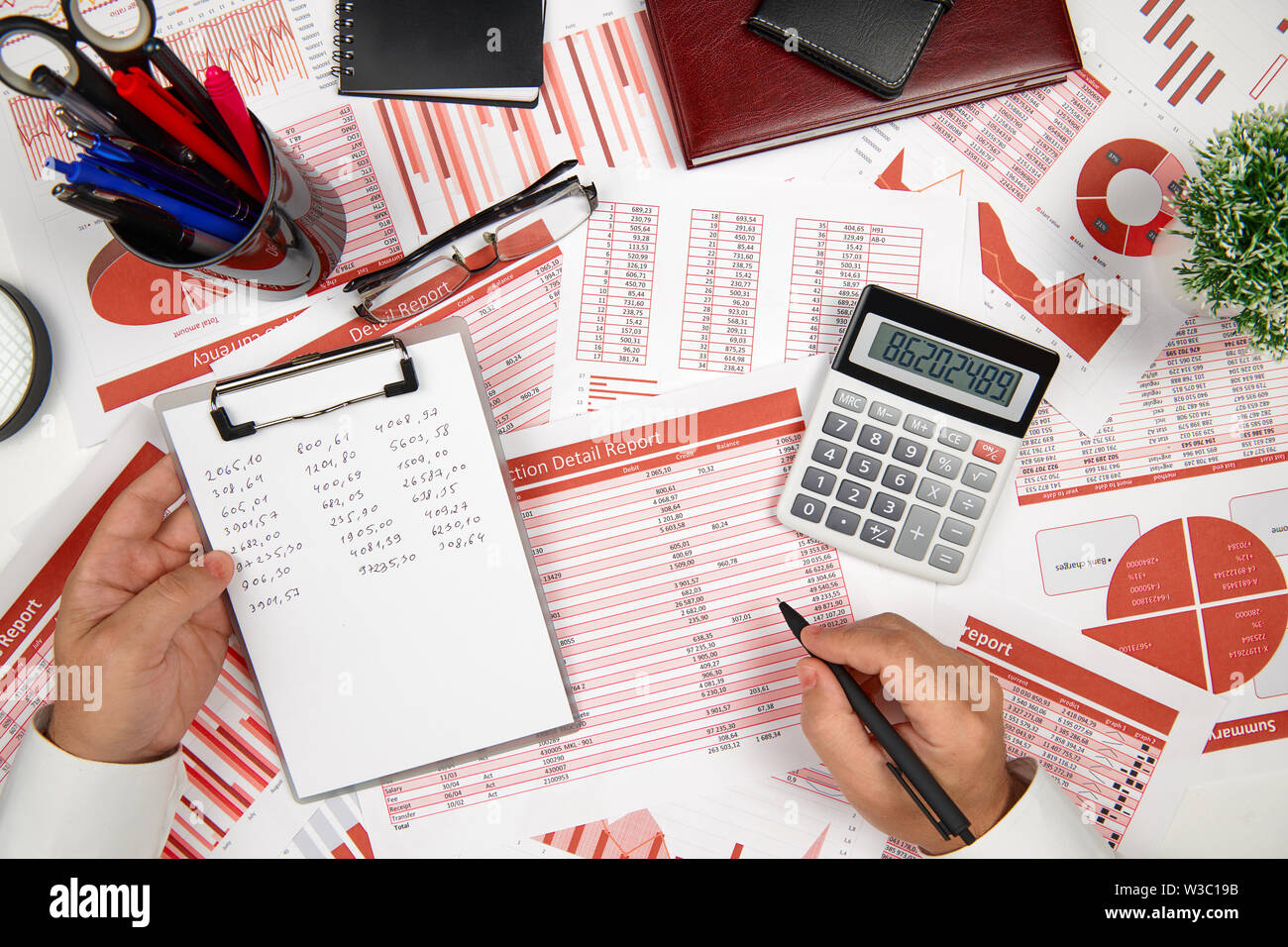 Business reports, data tables and charts - directly above view of ...