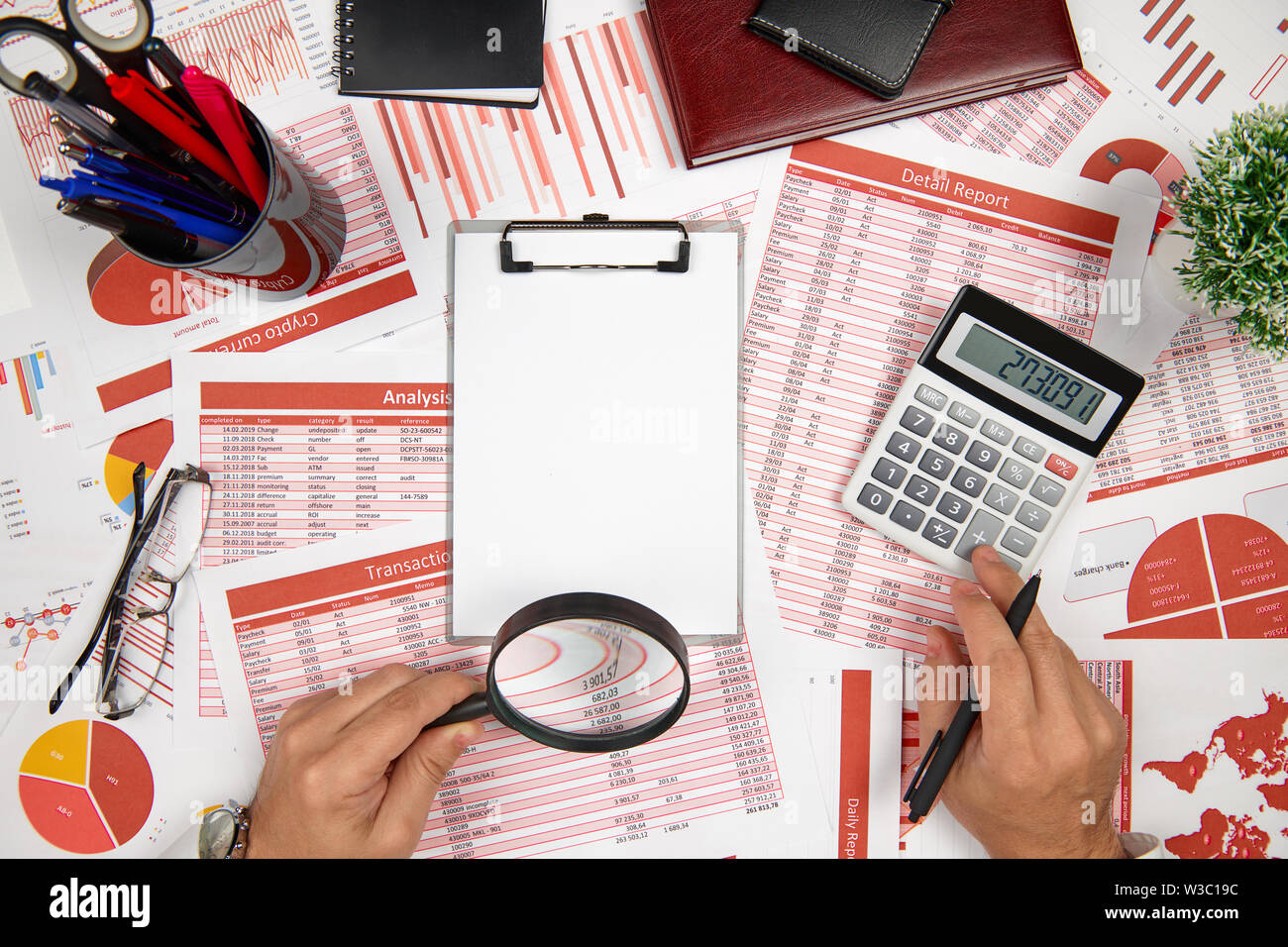 Business reports, blank paper sheet, data tables and charts - directly ...