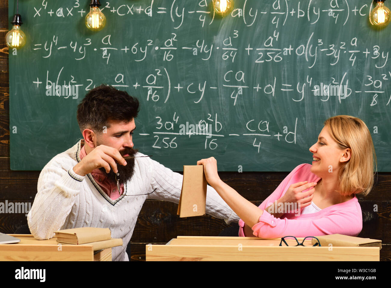 Back to school with tutor. Teamwork at education centre. Group lesson ...