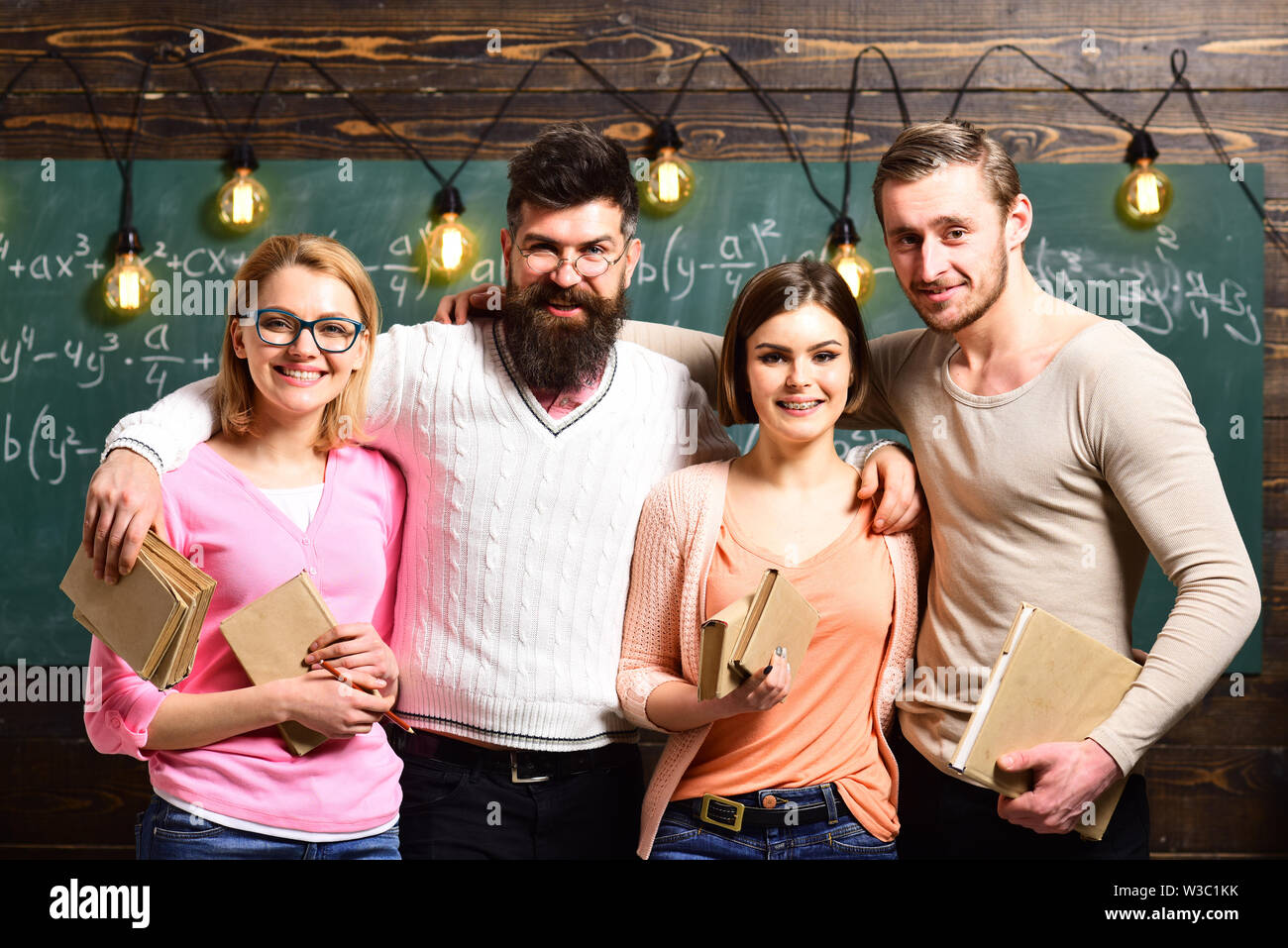 Diverse education shoot of happy students in classroom Stock Photo - Alamy