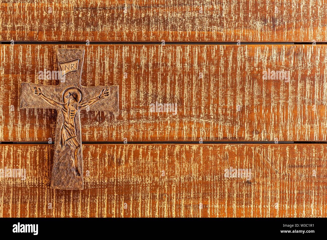 Christian cross on the wooden table. Beautiful old cross with jesus on ...