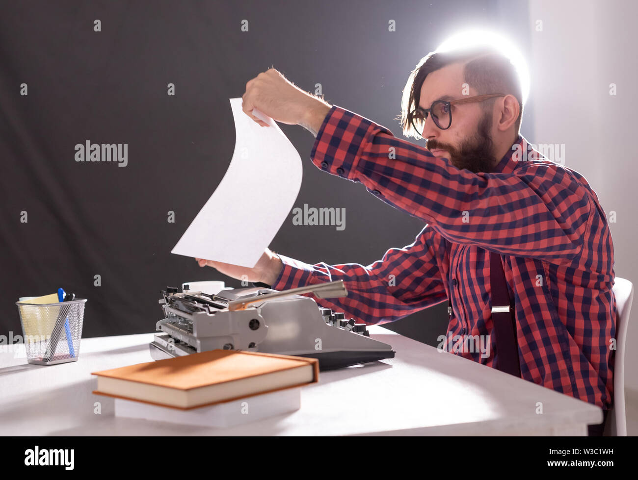 people, writer and hipster concept - young stylish writer working on ...