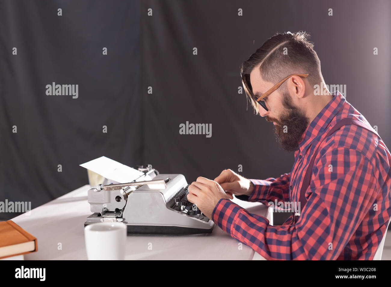 people, writer and hipster concept - young stylish writer working on ...