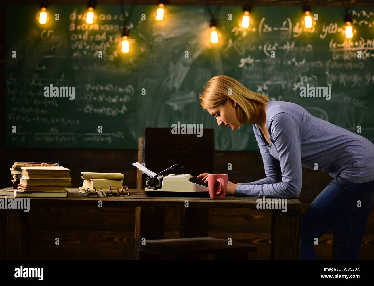 Writer at work. woman writer typing on old typewriter in school Stock ...