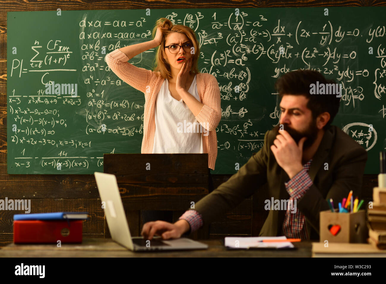 Student writing composition for annual exams preparation, Friendly ...