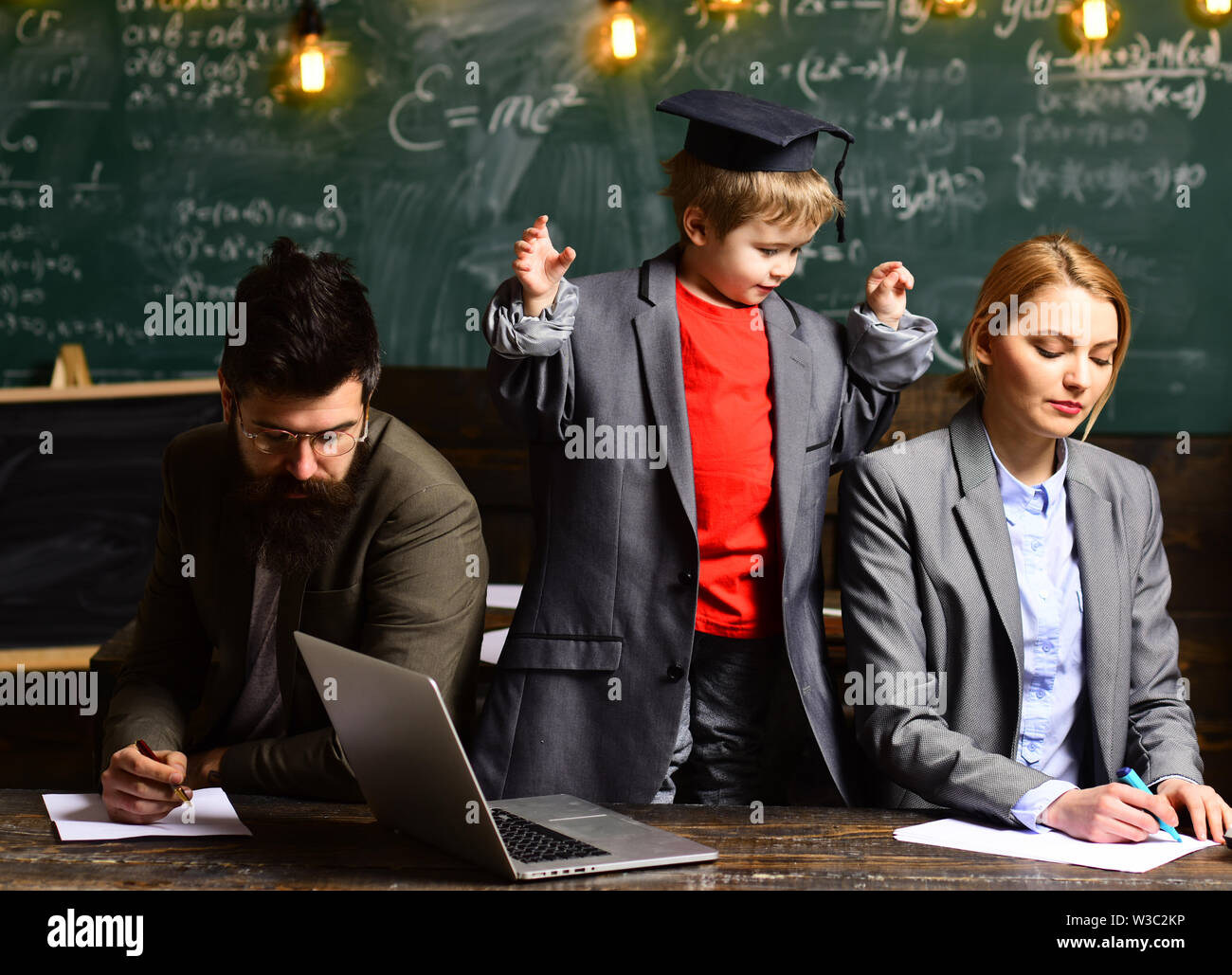 International student making individual online testing. Teacher adjusts ...