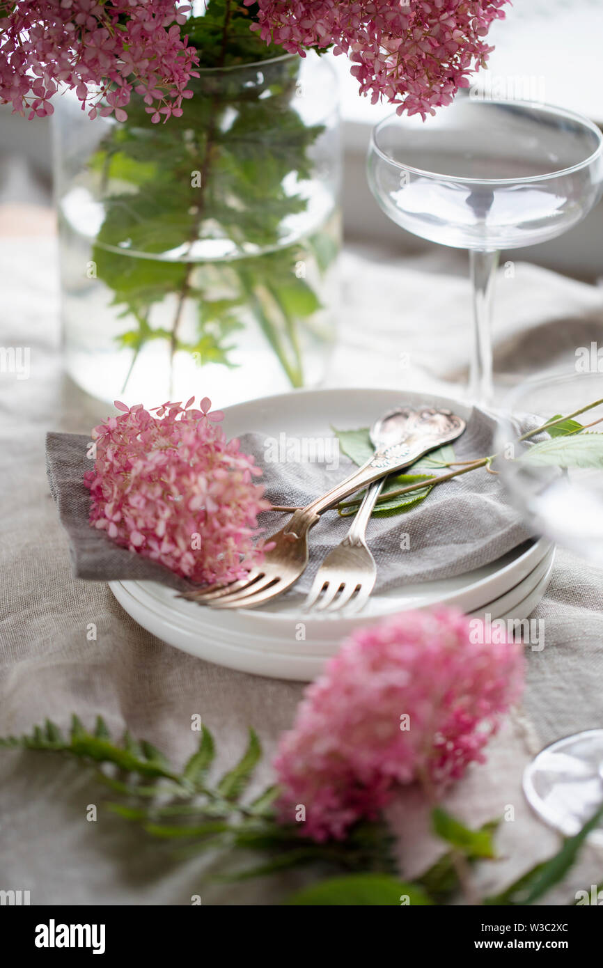 Table setting with hydrangea flowers Stock Photo - Alamy
