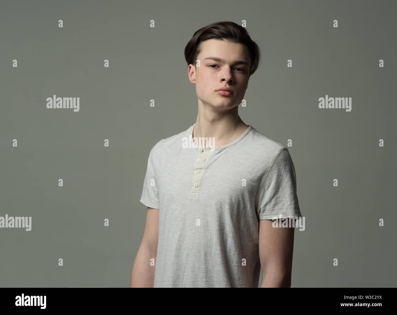 Guy on confident face in light shirt, grey background. Macho with ...