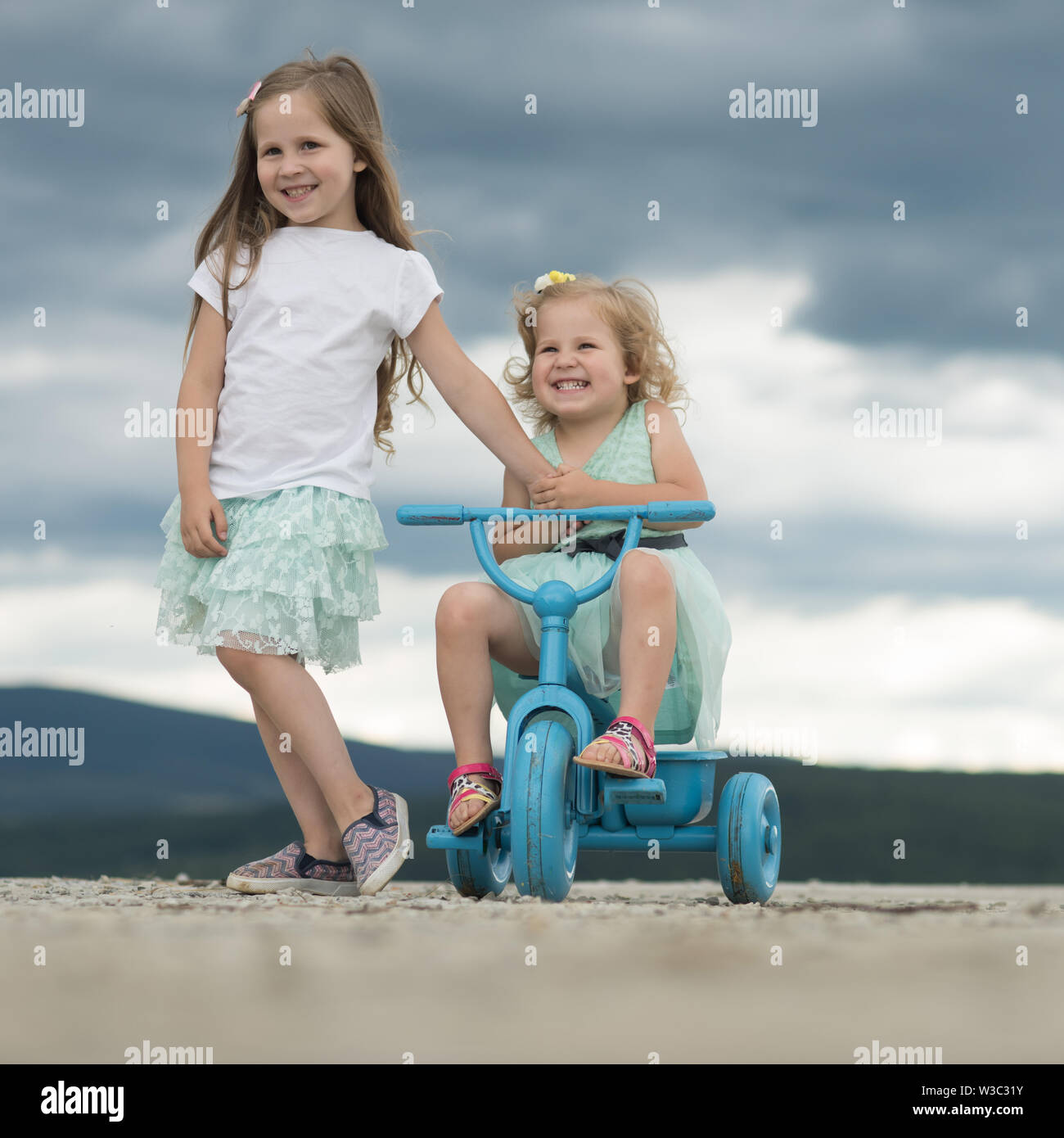 Happy childhood, family, love. Children playing in mountain. Summer ...