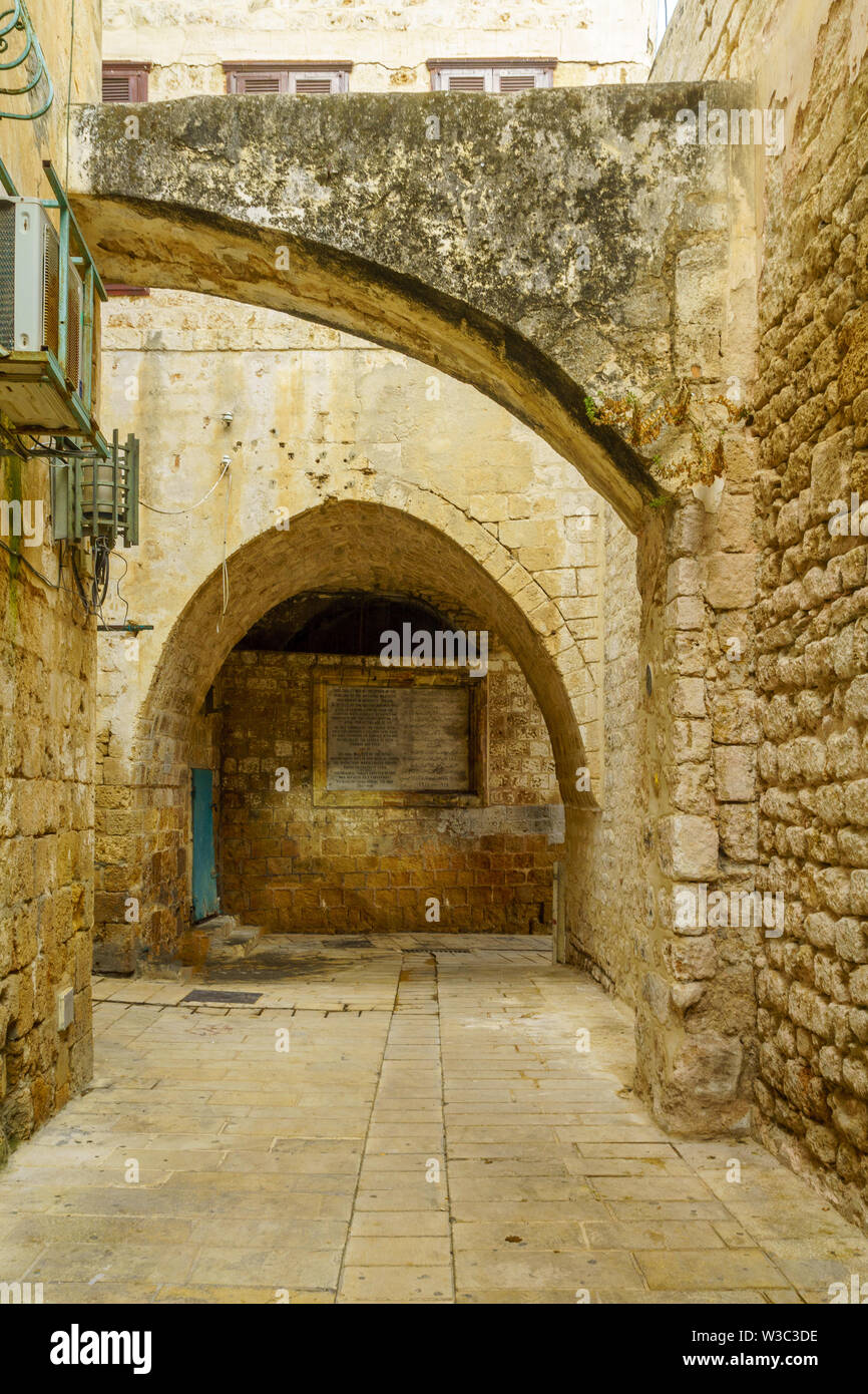 View of an alley with historic tablet, in the old city of Acre (Akko ...