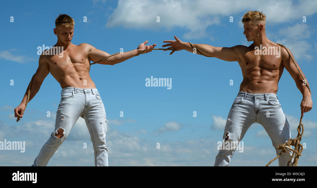 Confident in themselves. Athletic twins on opposite sides. Twins ...