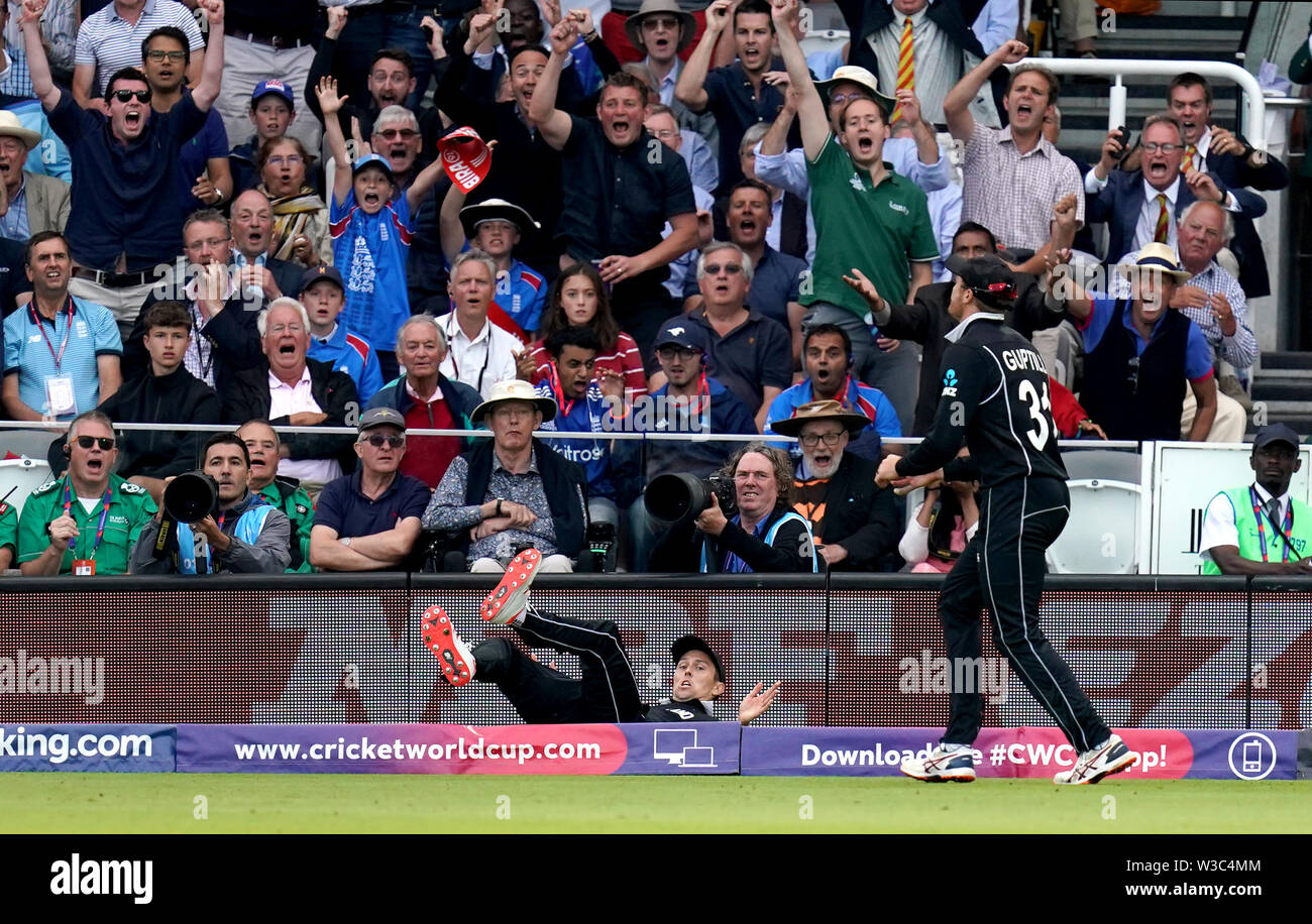 New Zealand's Trent Boult stumbles over the boundary during the ICC ...