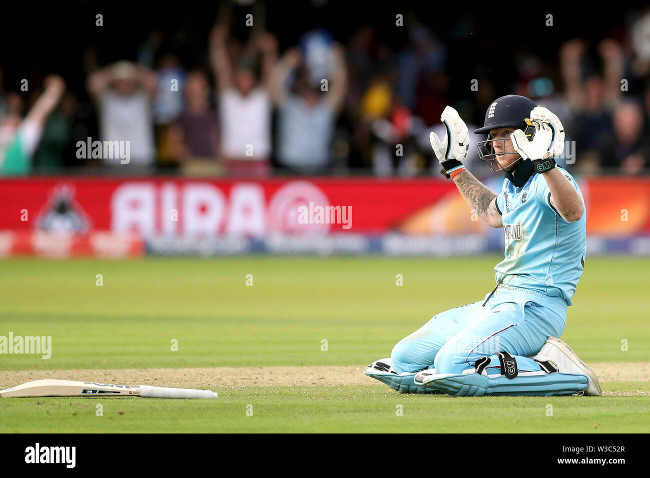 England's Ben Stokes reacts after the ball hits his bat during the ICC ...