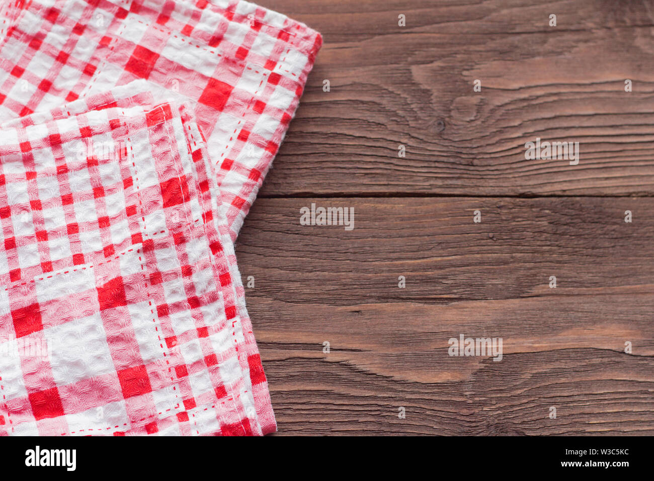 checkered napkins on a wooden background,close-up Stock Photo - Alamy