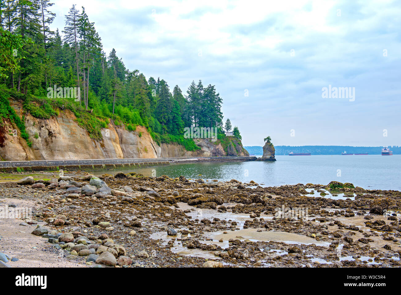 View of the Siwash Rock taken at Stanley Park seawall trail in ...