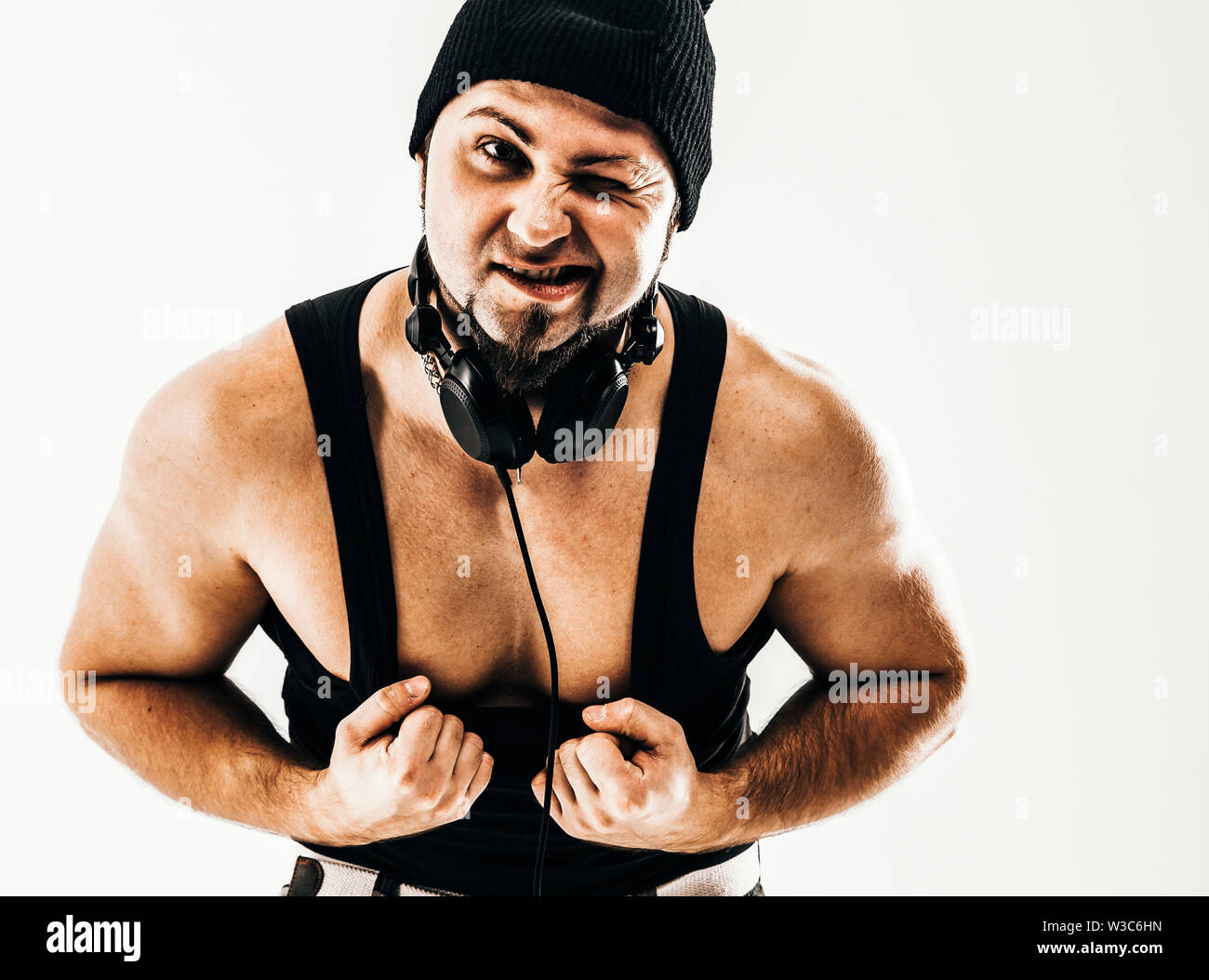 rapper with narrowed eyes with headphones on a white background Stock ...