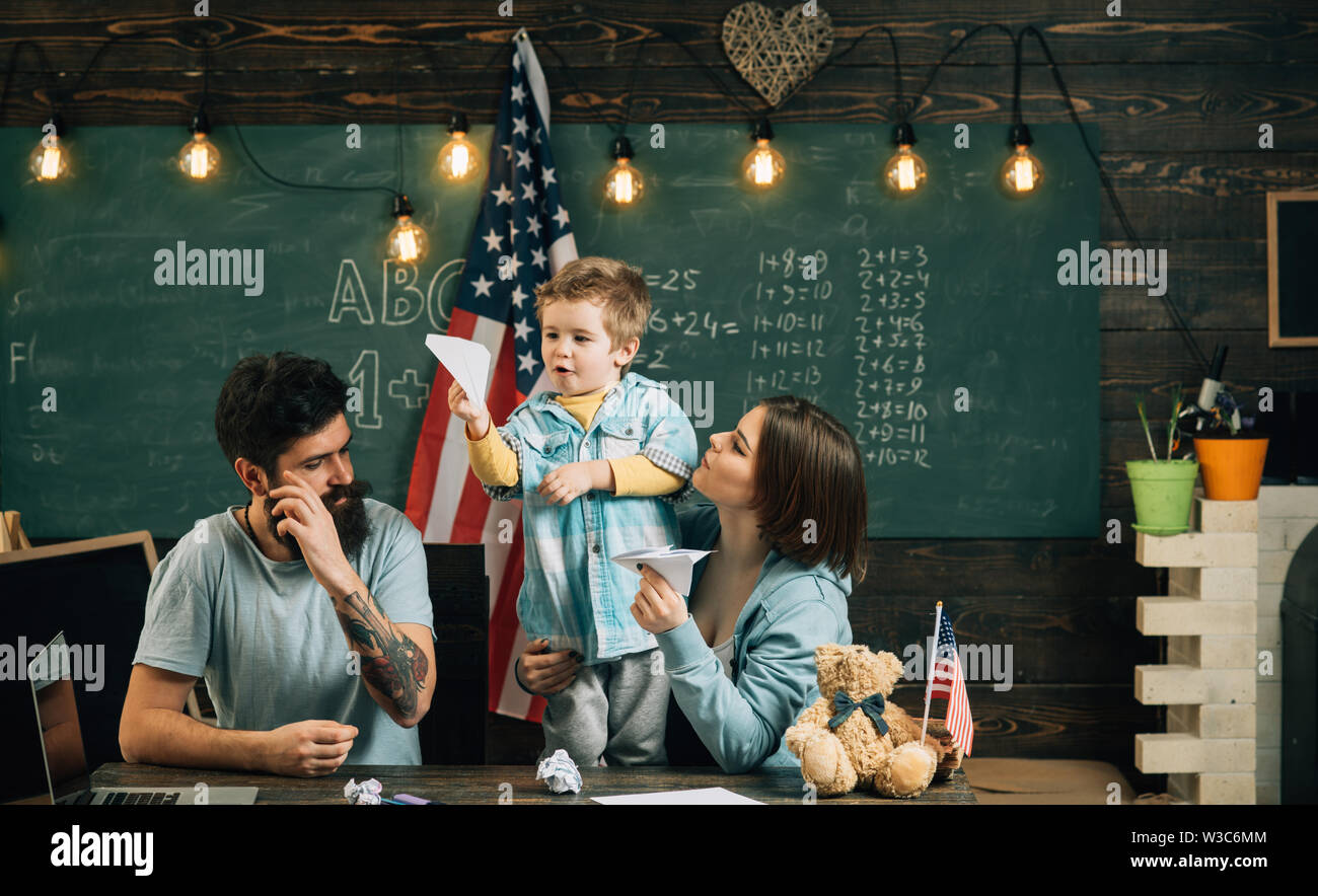 Parents teaching son american traditions playing. Kid with parents in ...