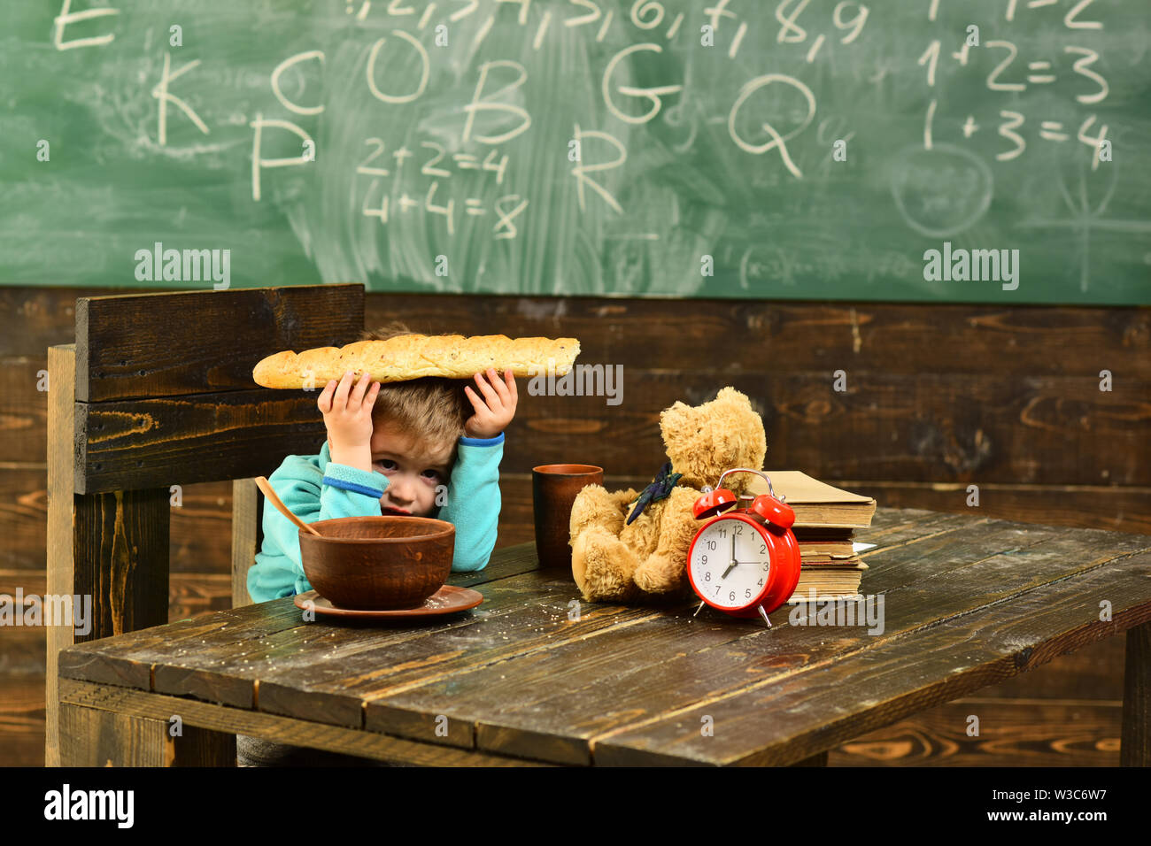 Break time. Little boy relax during school break. Child have lunch ...