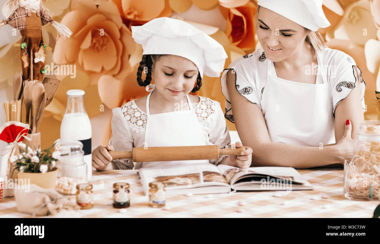 mother and daughter playing in the chefs and cooks dinner in the ...