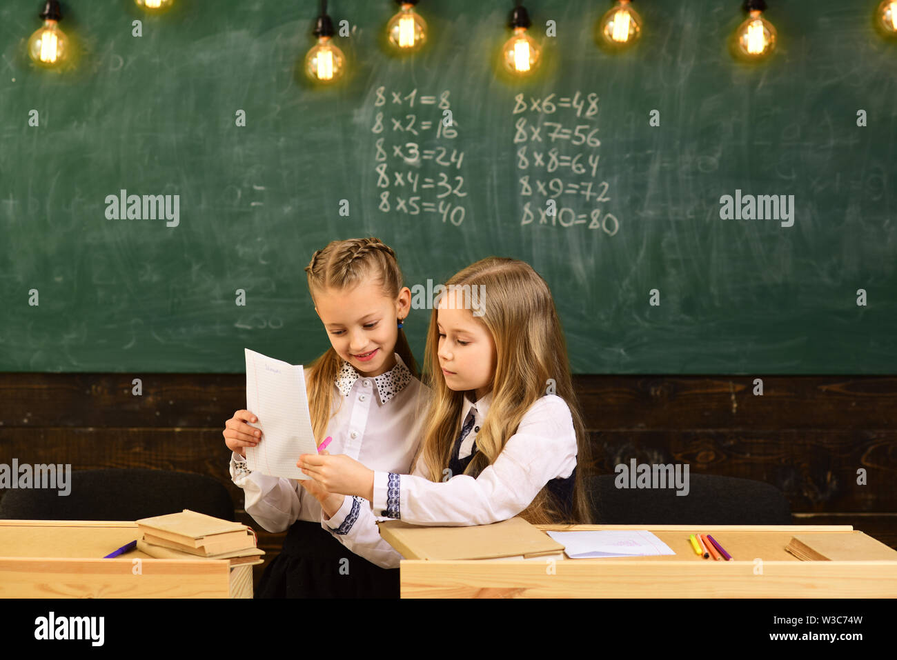 pupils in school uniform. two happy pupils in school uniform. school ...