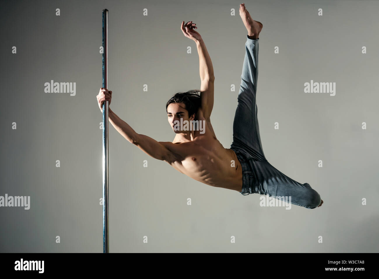 fly in mind. fly man while dancing on pylon Stock Photo - Alamy