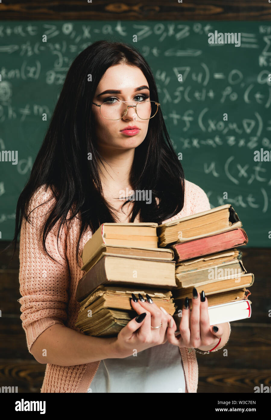 Nerd girl reading old book hi-res stock photography and images - Alamy