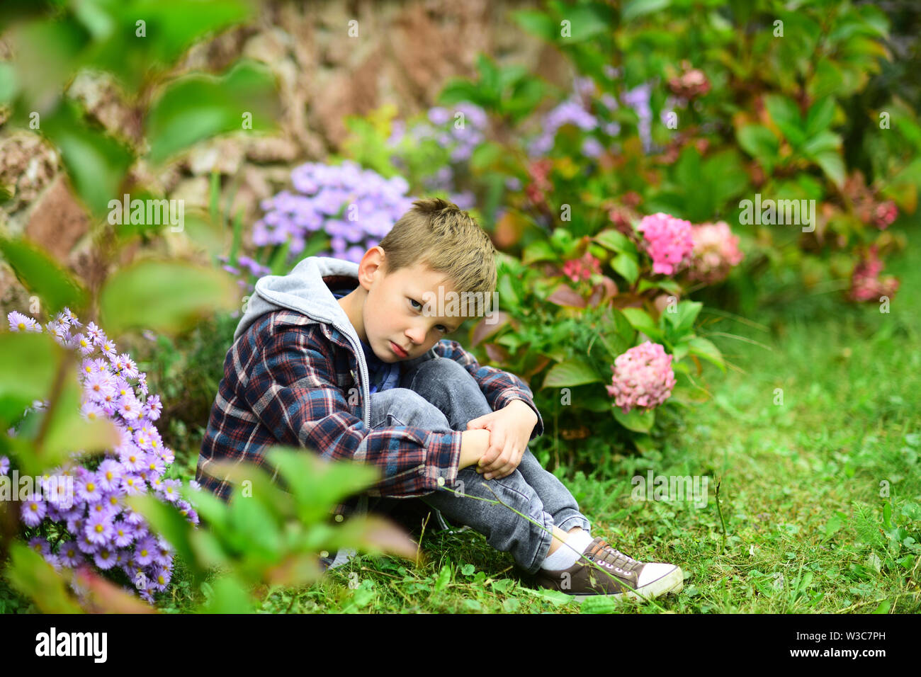 Unhappy and miserable. Little boy in deep sorrow. Little boy with sad ...