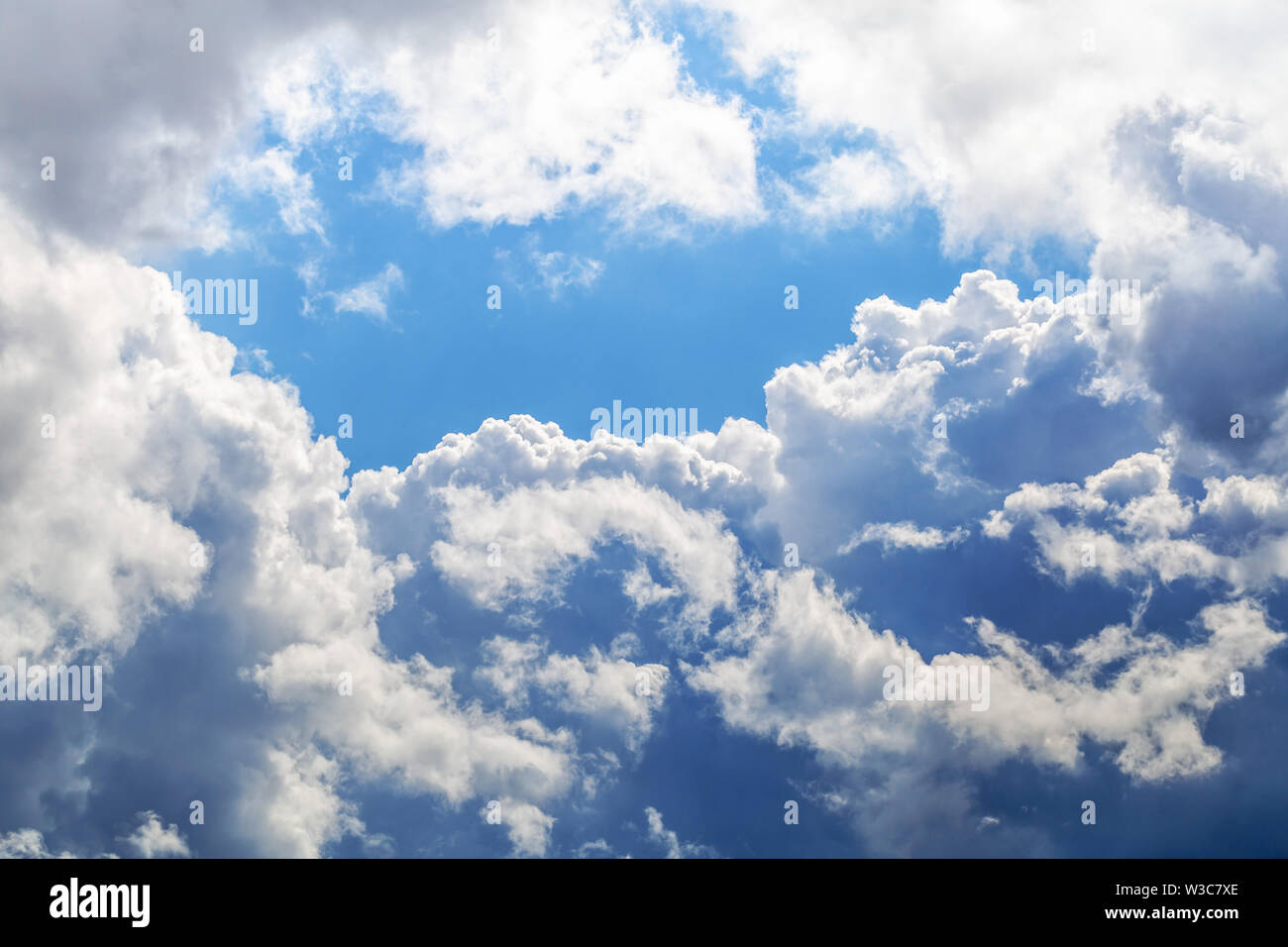 Blue sky background with cumulus clouds Stock Photo - Alamy