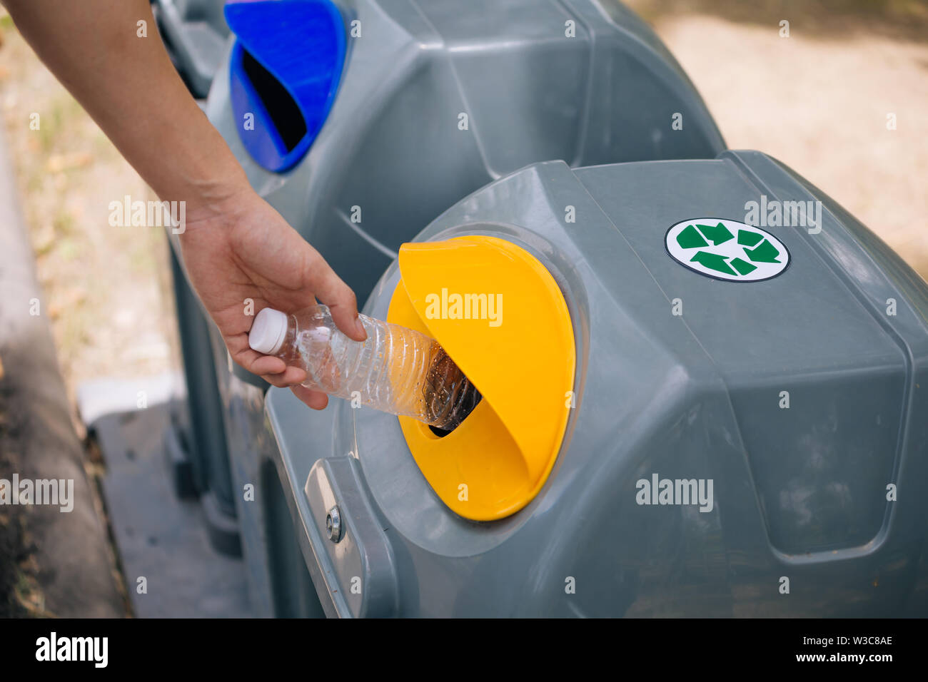 Putting rubbish into recycle bin hi-res stock photography and images ...