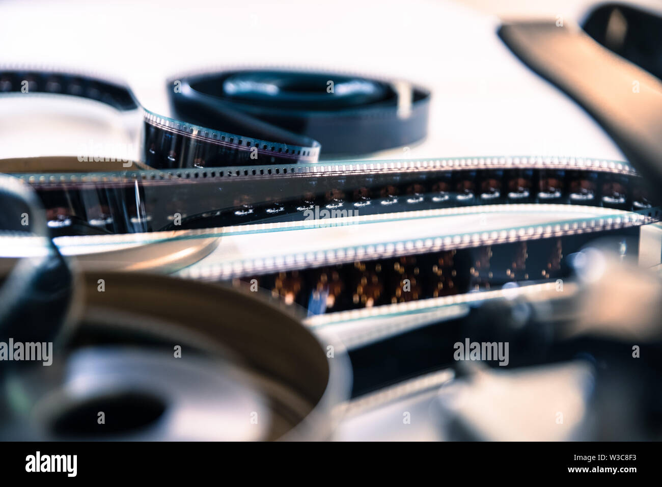 Filmstrip or film reel on a cutting table, vintage film production in ...