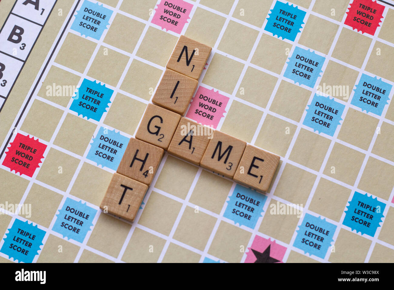Scrabble board game with the scrabble tile spell "Game Night Stock ...