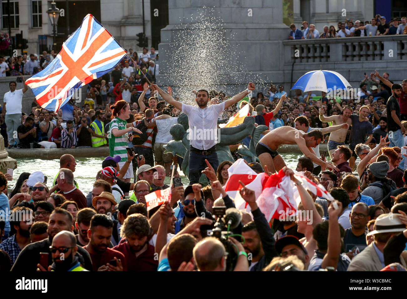 England fans celebrate in Trafalgar Square fountain after watching ...