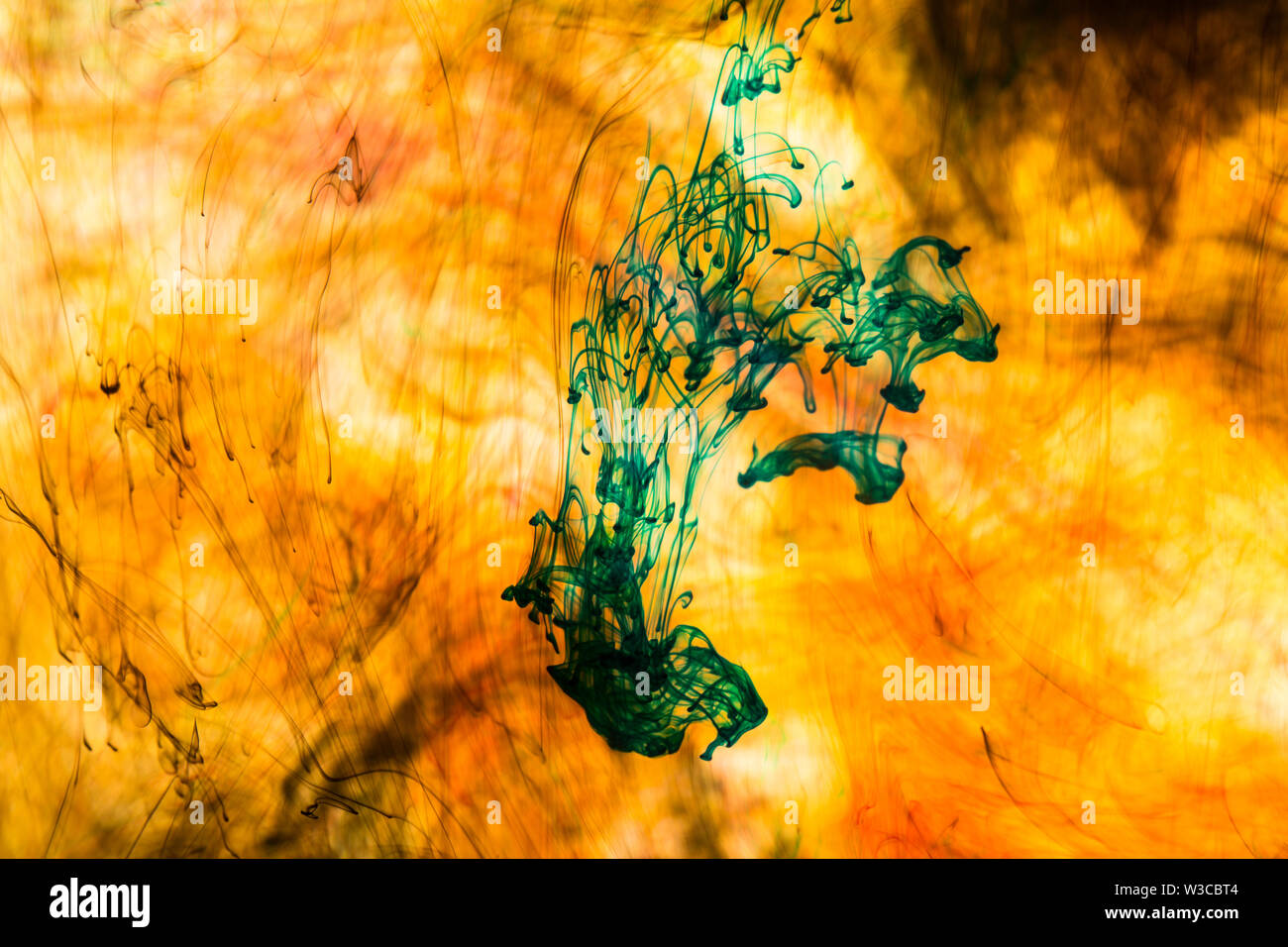 Acrylic colors and ink in water. Abstract background Stock Photo - Alamy