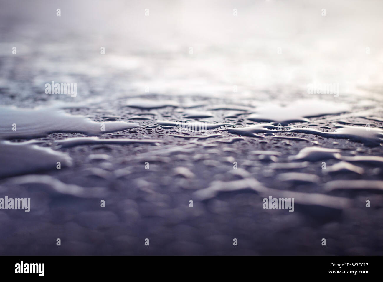 Water drops after the rain on the stone surface Stock Photo - Alamy
