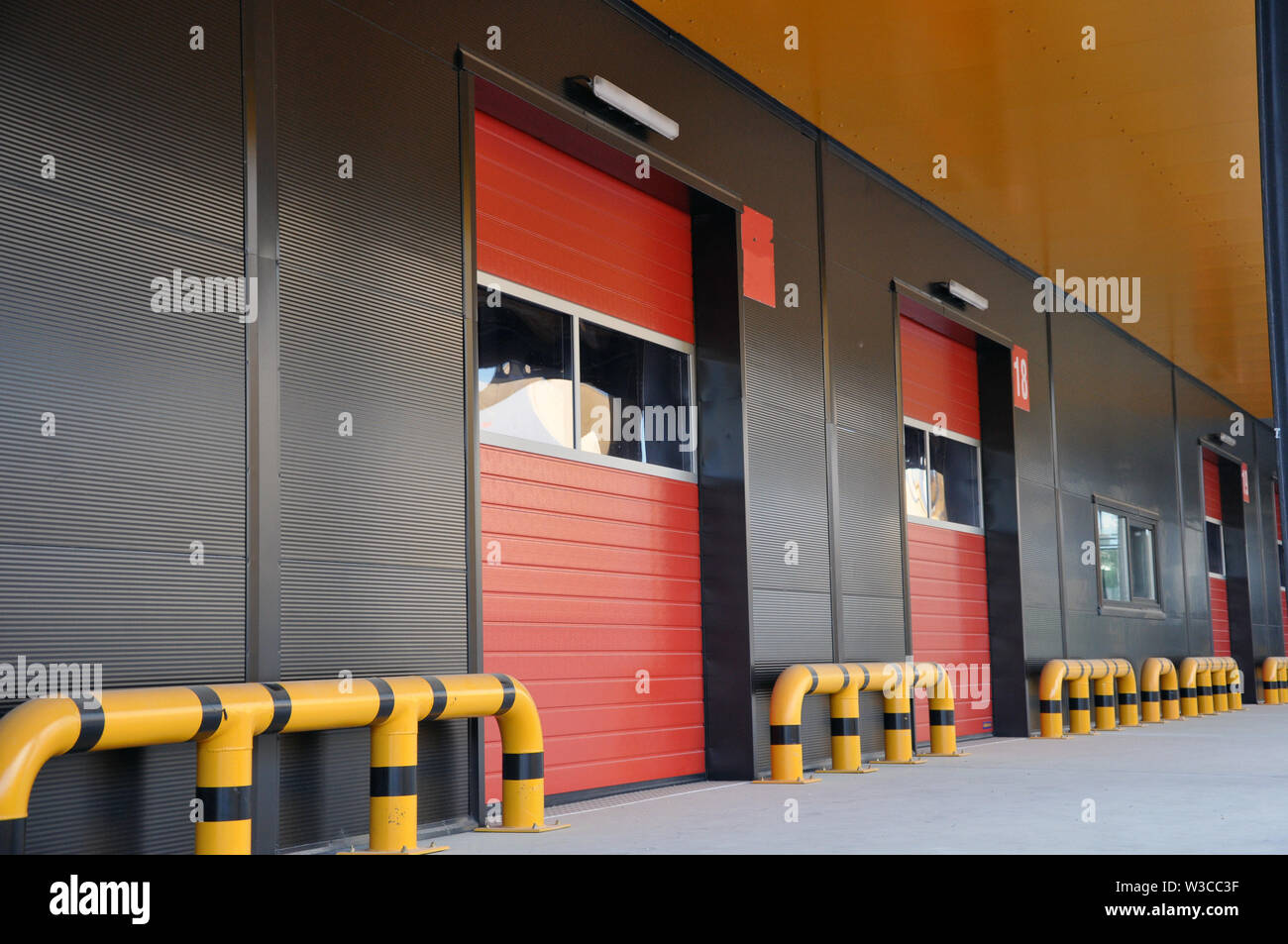 A Large distribution warehouse with gates for loading goods Stock Photo ...