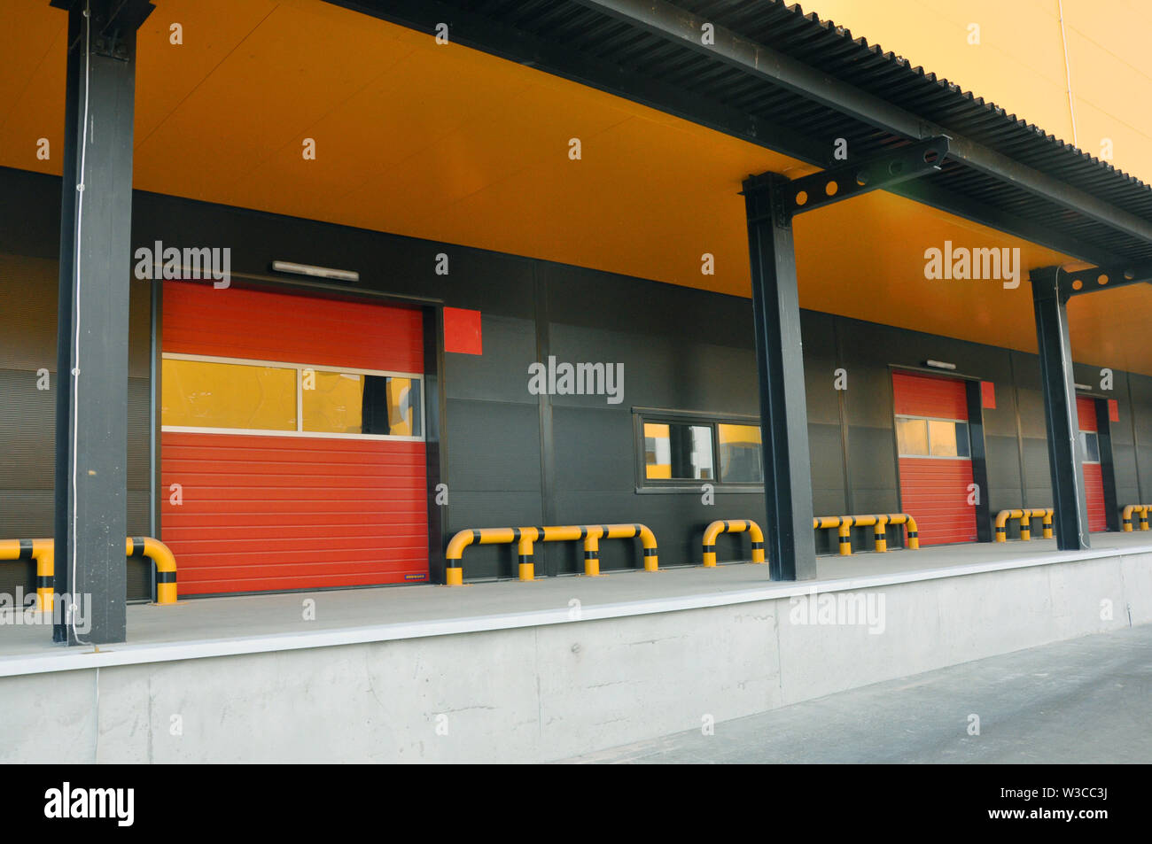A Large distribution warehouse with gates for loading goods Stock Photo ...