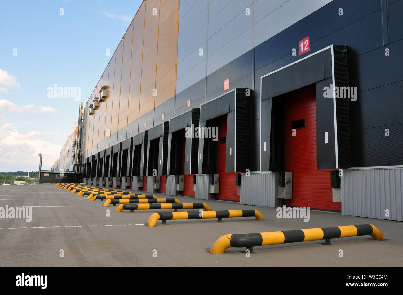A Large distribution warehouse with gates for loading goods Stock Photo ...