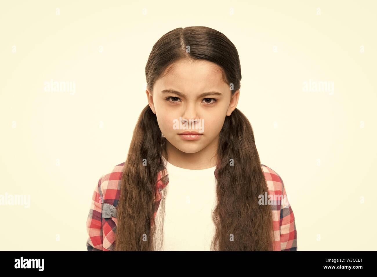 Kid girl suspect you. Brutal revenge. Unhappy child hateful glance ...